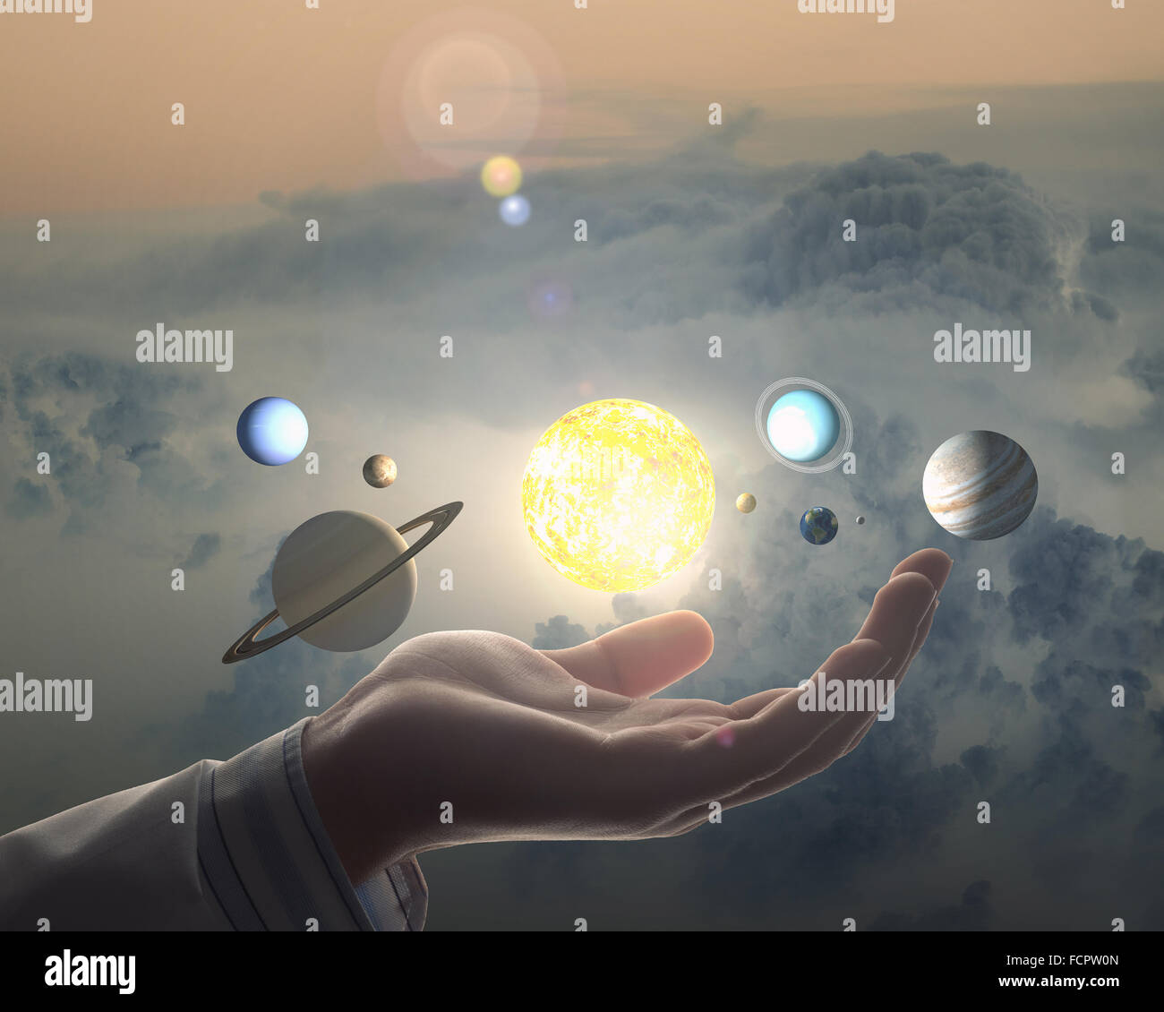 Close up of planet sun system in your hand Stock Photo - Alamy