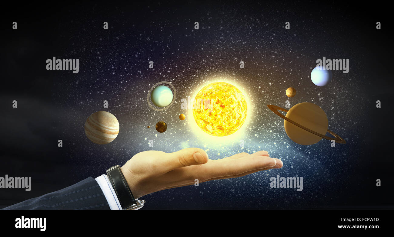 Close up of planet sun system in your hand Stock Photo - Alamy