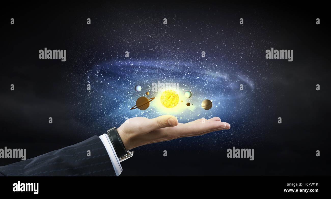 Close up of planet sun system in your hand Stock Photo - Alamy