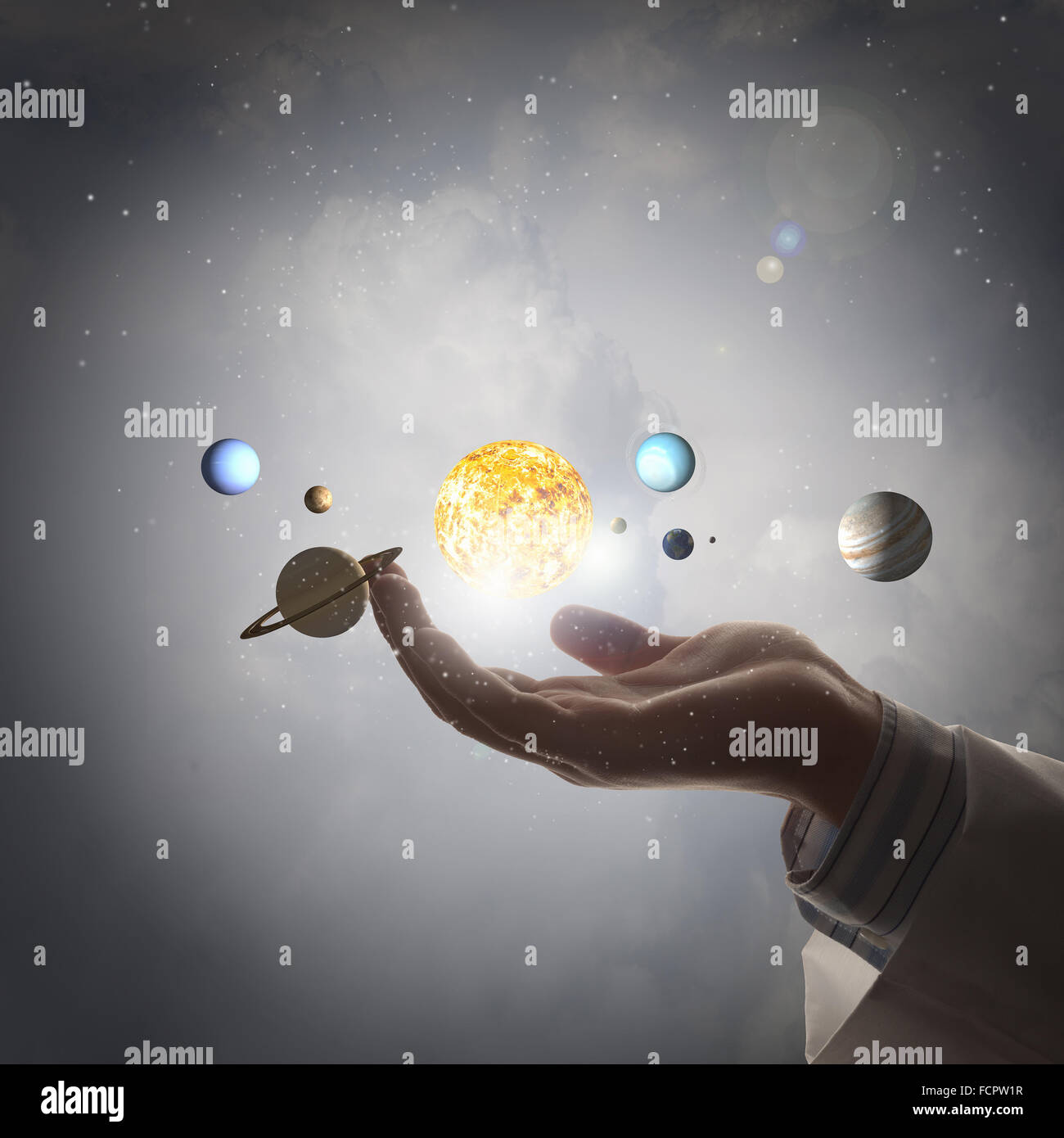 Close up of planet sun system in your hand Stock Photo - Alamy