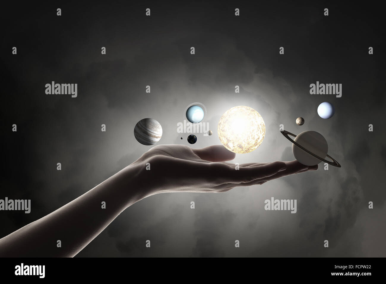 Close up of planet sun system in your hand Stock Photo - Alamy
