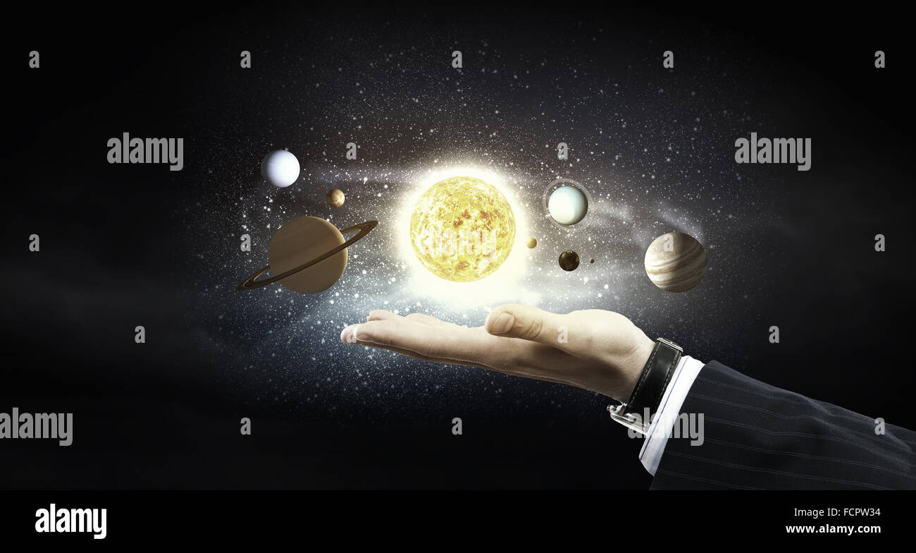 Close up of planet sun system in your hand Stock Photo - Alamy