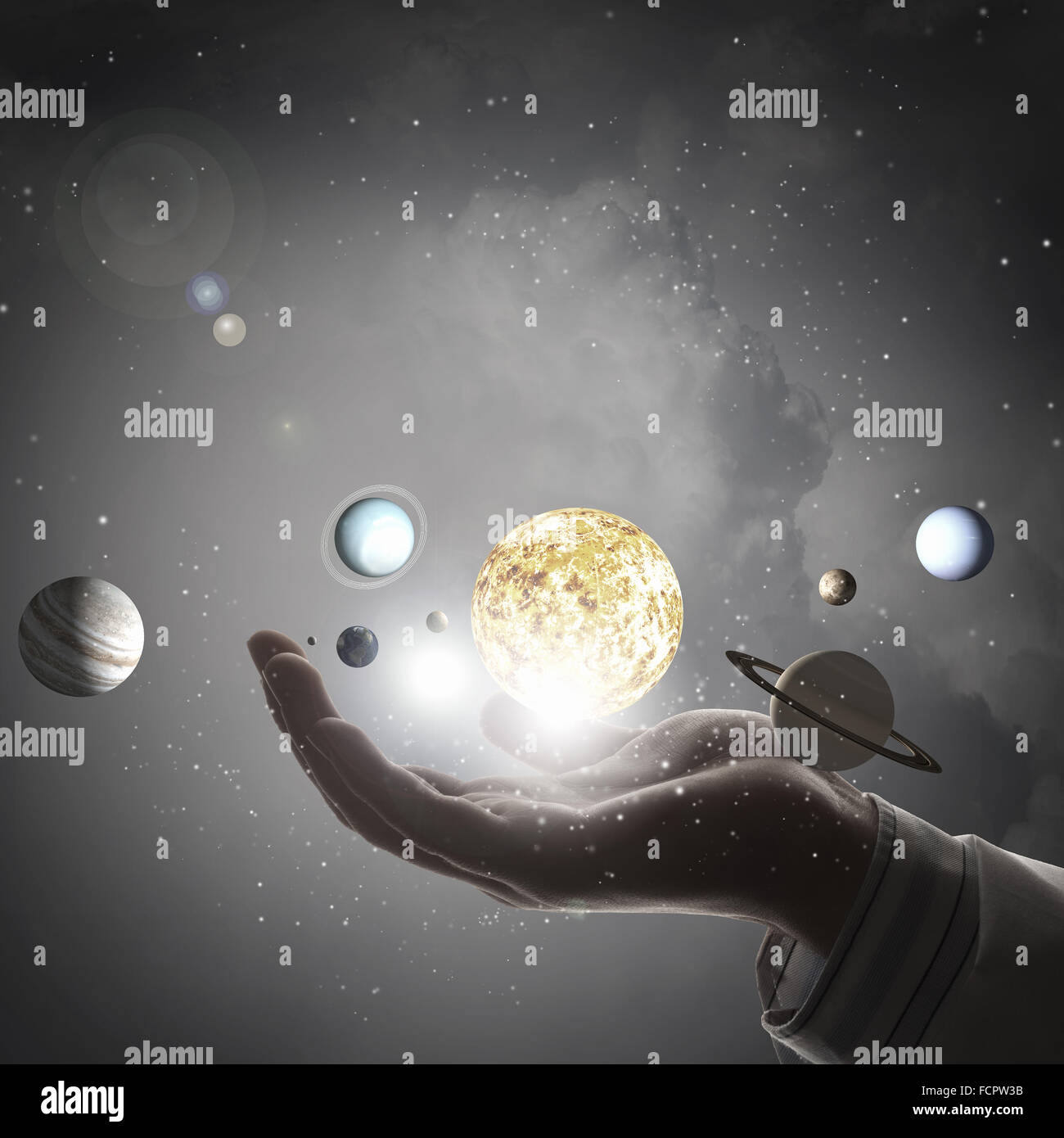 Close up of planet sun system in your hand Stock Photo - Alamy