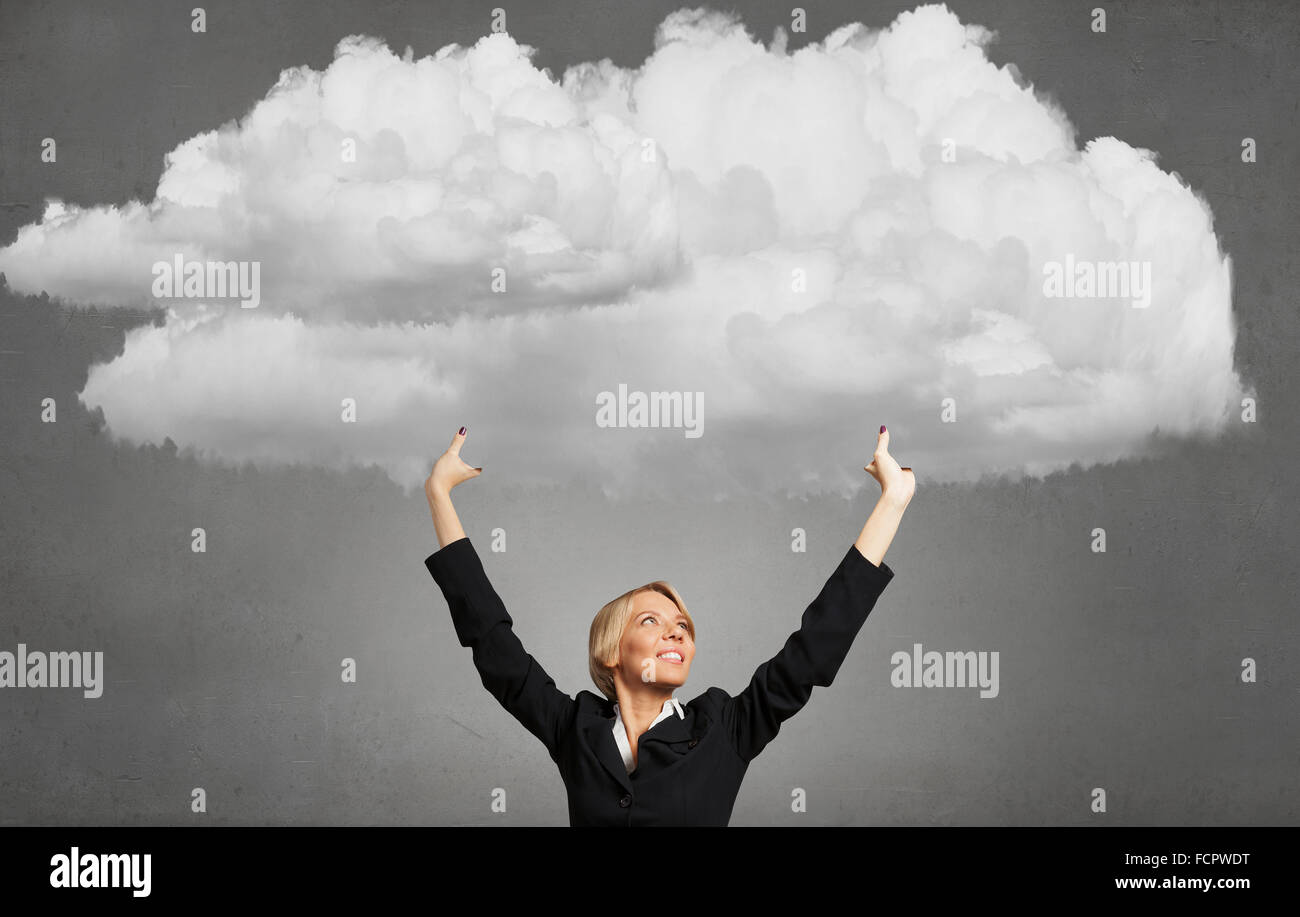 Young businesswoman holding white cloud above head Stock Photo - Alamy