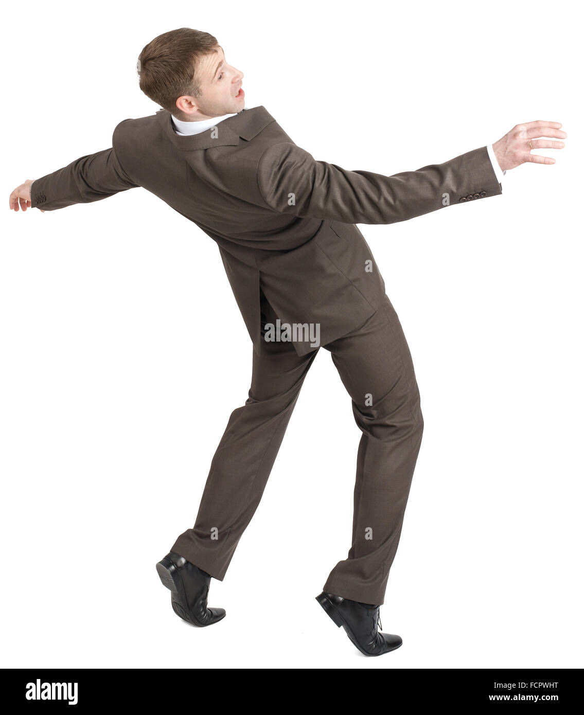 Businessman almost falling back Stock Photo - Alamy