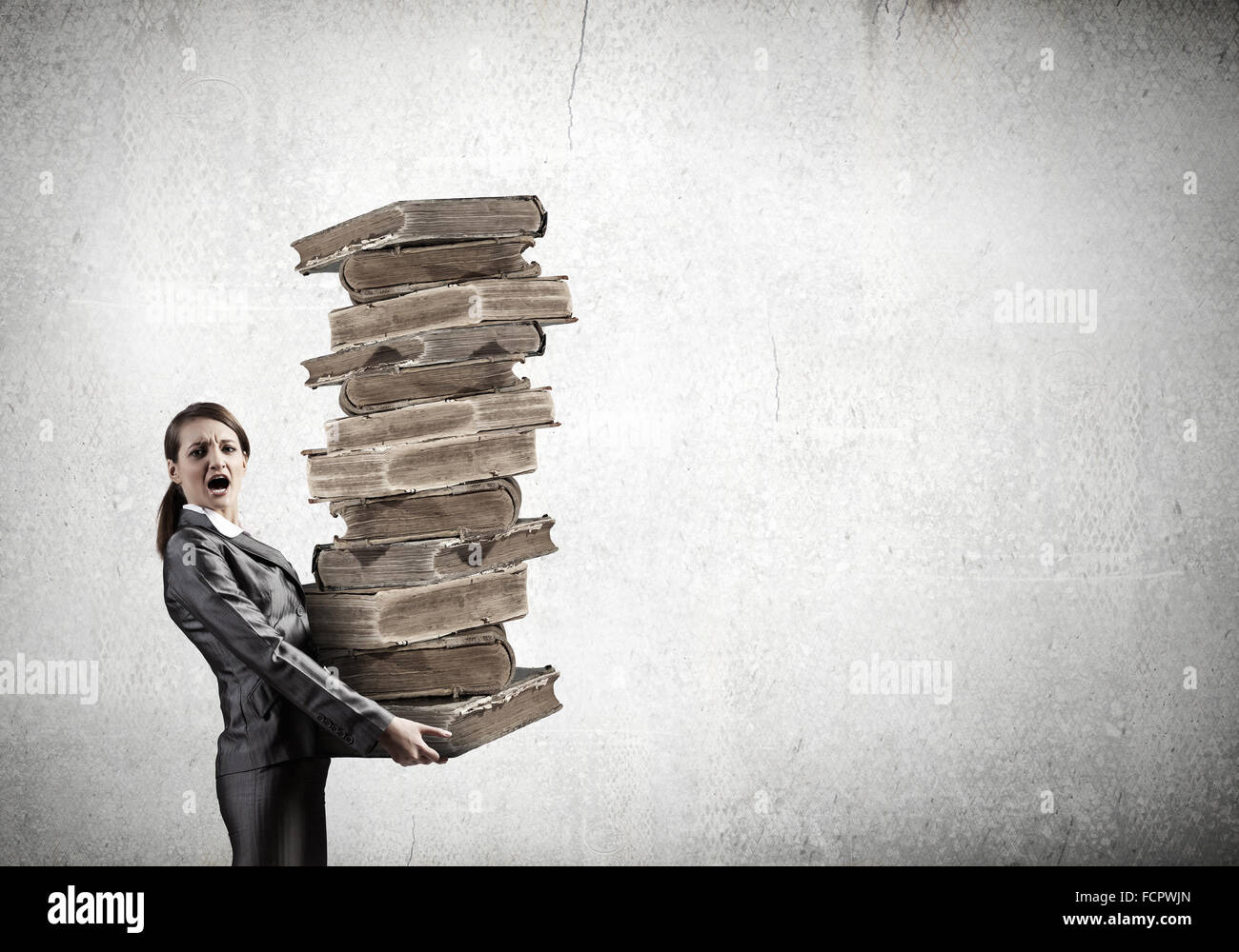 Businesswoman carrying books hi-res stock photography and images - Alamy