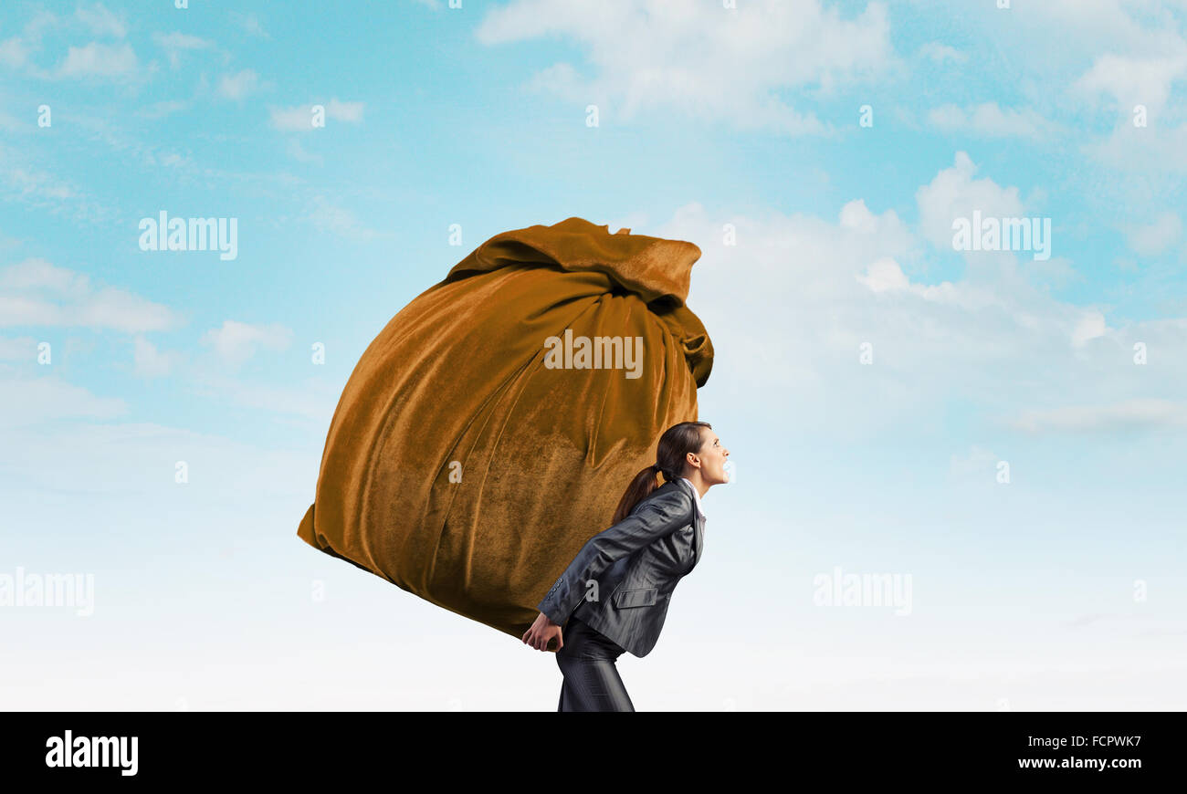 Businesswoman carrying big heavy bag on back Stock Photo - Alamy