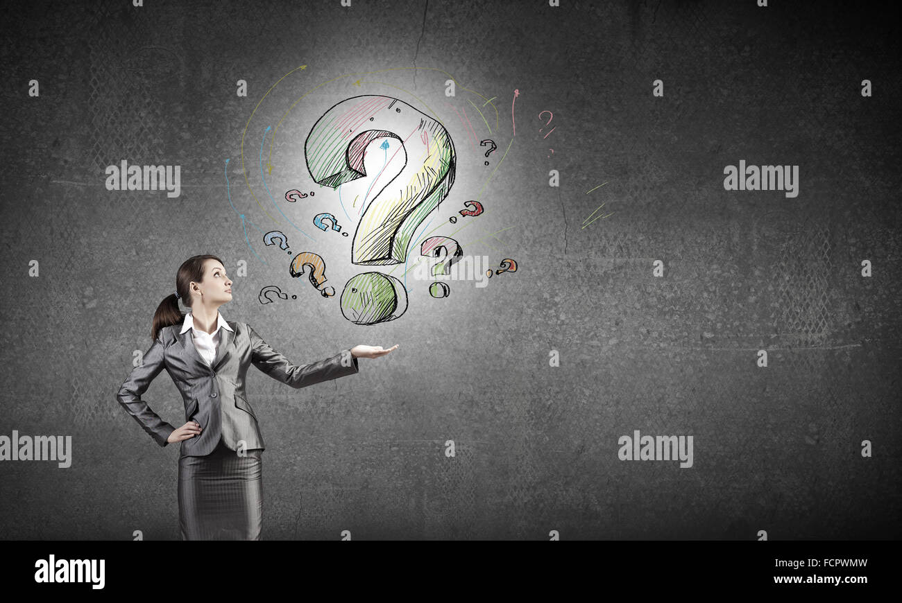 Young businesswoman holding question mark in palm Stock Photo - Alamy