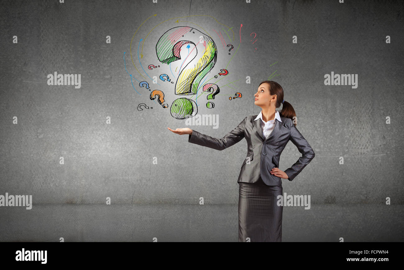 Young businesswoman holding question mark in palm Stock Photo - Alamy