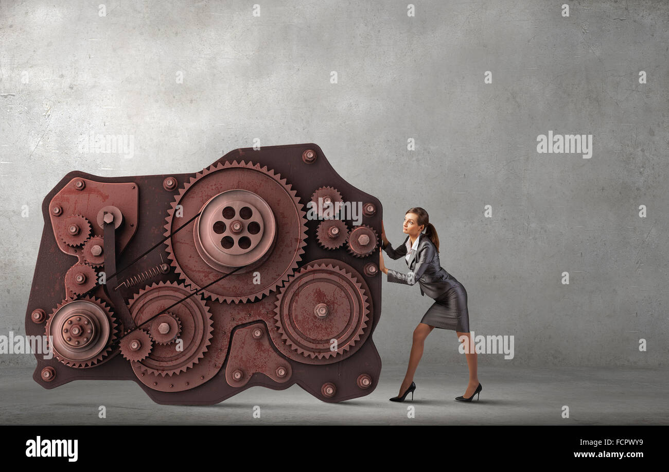 Clockwork mechanism moving gears hi-res stock photography and images ...