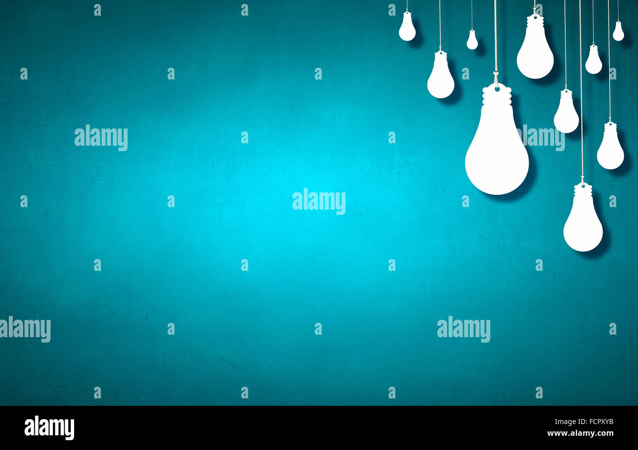 Many light bulbs on color background hanging from above Stock Photo - Alamy