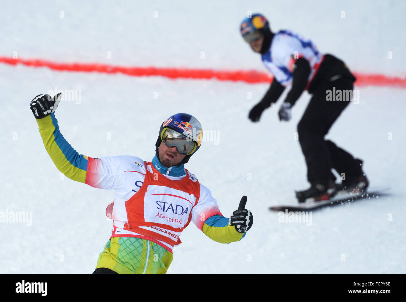 1st-place winner Pierre Vaultier of France (L) wins the Snowboard Cross ...