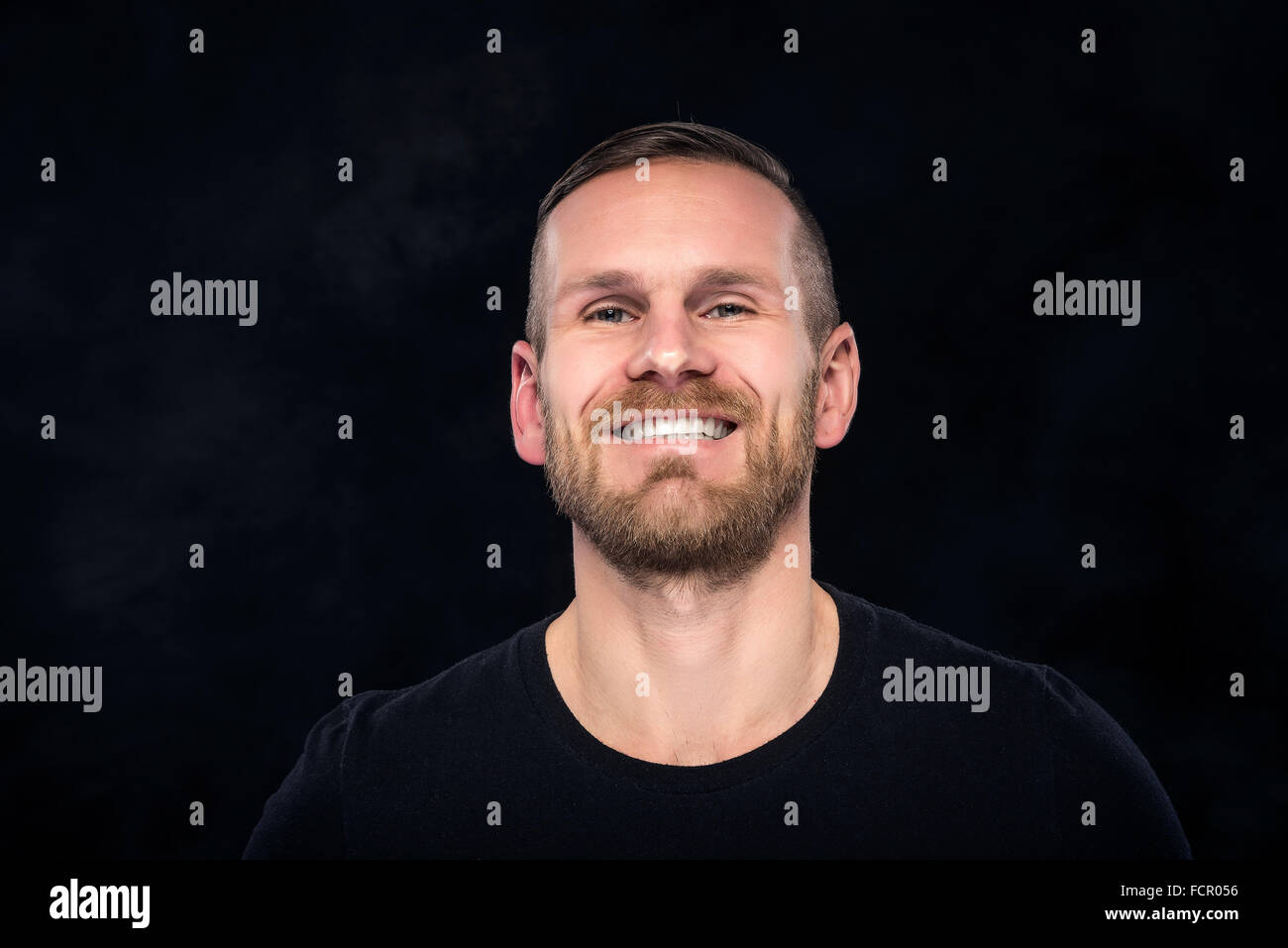 Handsome man looking at camera Stock Photo - Alamy