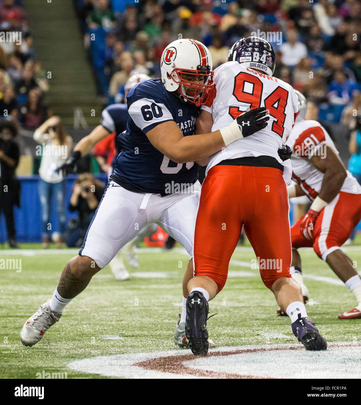 St. 23rd Jan, 2016. West center Siaosi Aiono, of Utah, (60) and East ...