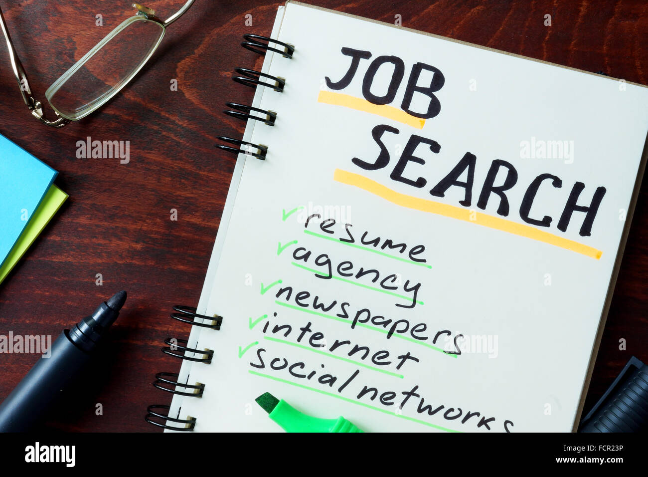 Notepad with Job Search on the wooden table Stock Photo - Alamy