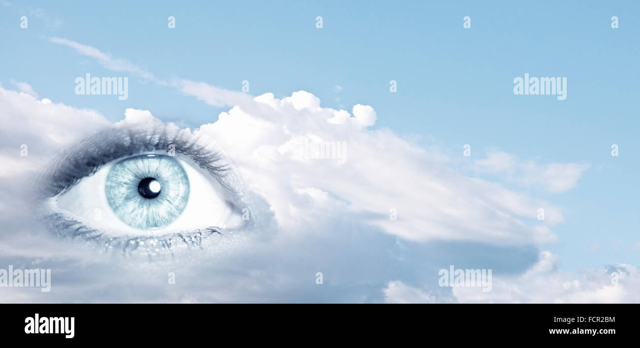 Female clear eye on blue sky background Stock Photo - Alamy