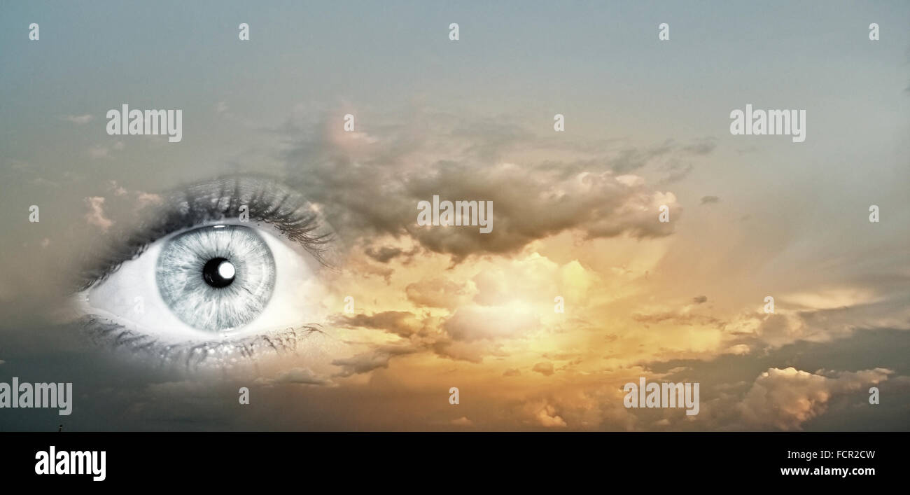 Female clear eye on blue sky background Stock Photo - Alamy