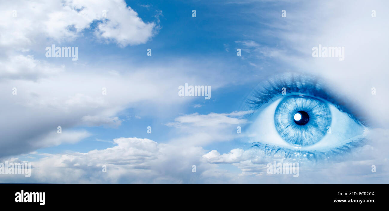Female clear eye on blue sky background Stock Photo - Alamy