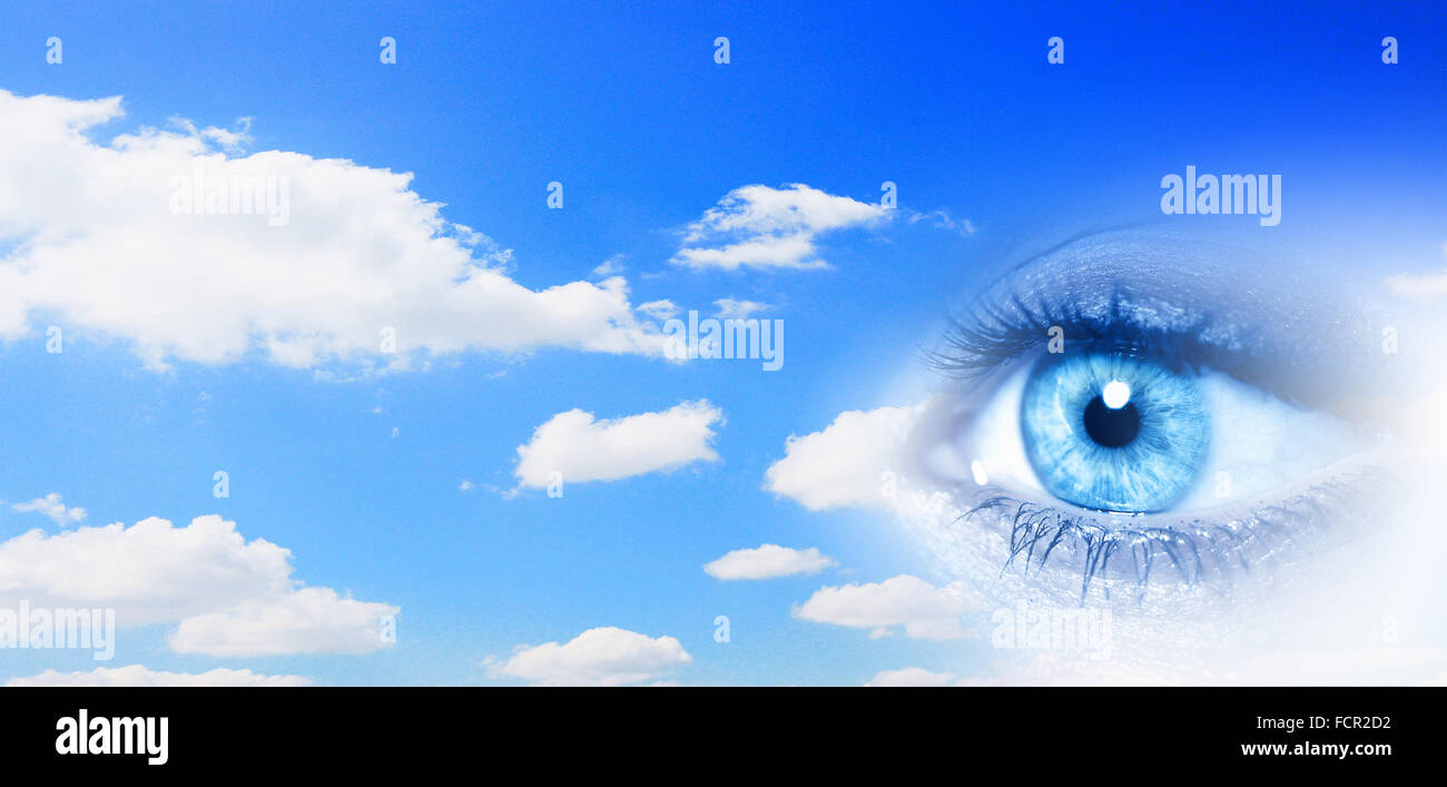 Female clear eye on blue sky background Stock Photo - Alamy
