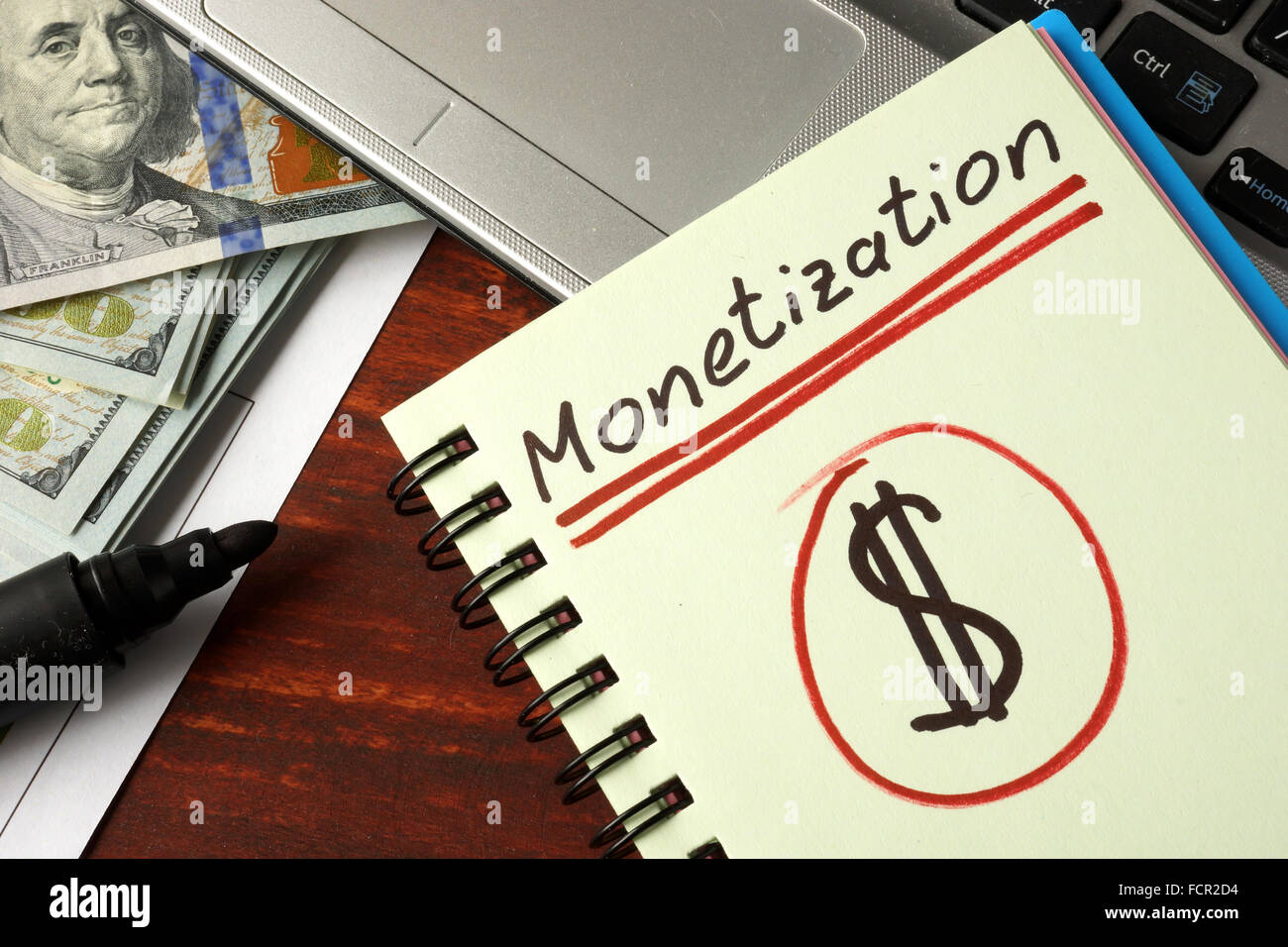 Notebook with monetization sign. Business concept Stock Photo - Alamy
