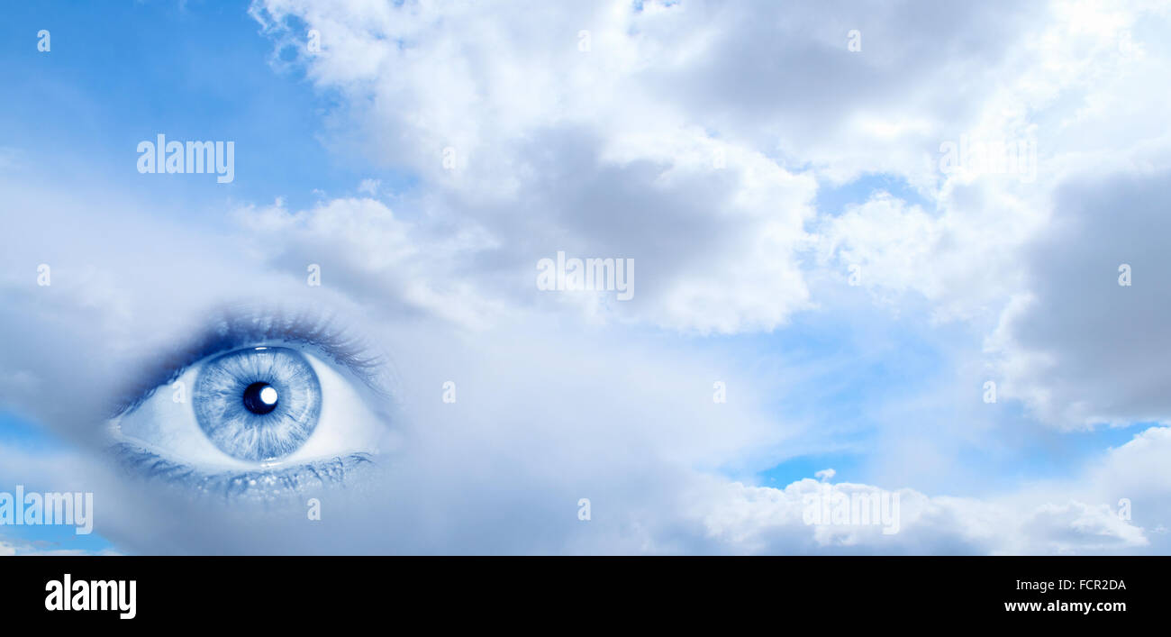 Female clear eye on blue sky background Stock Photo - Alamy