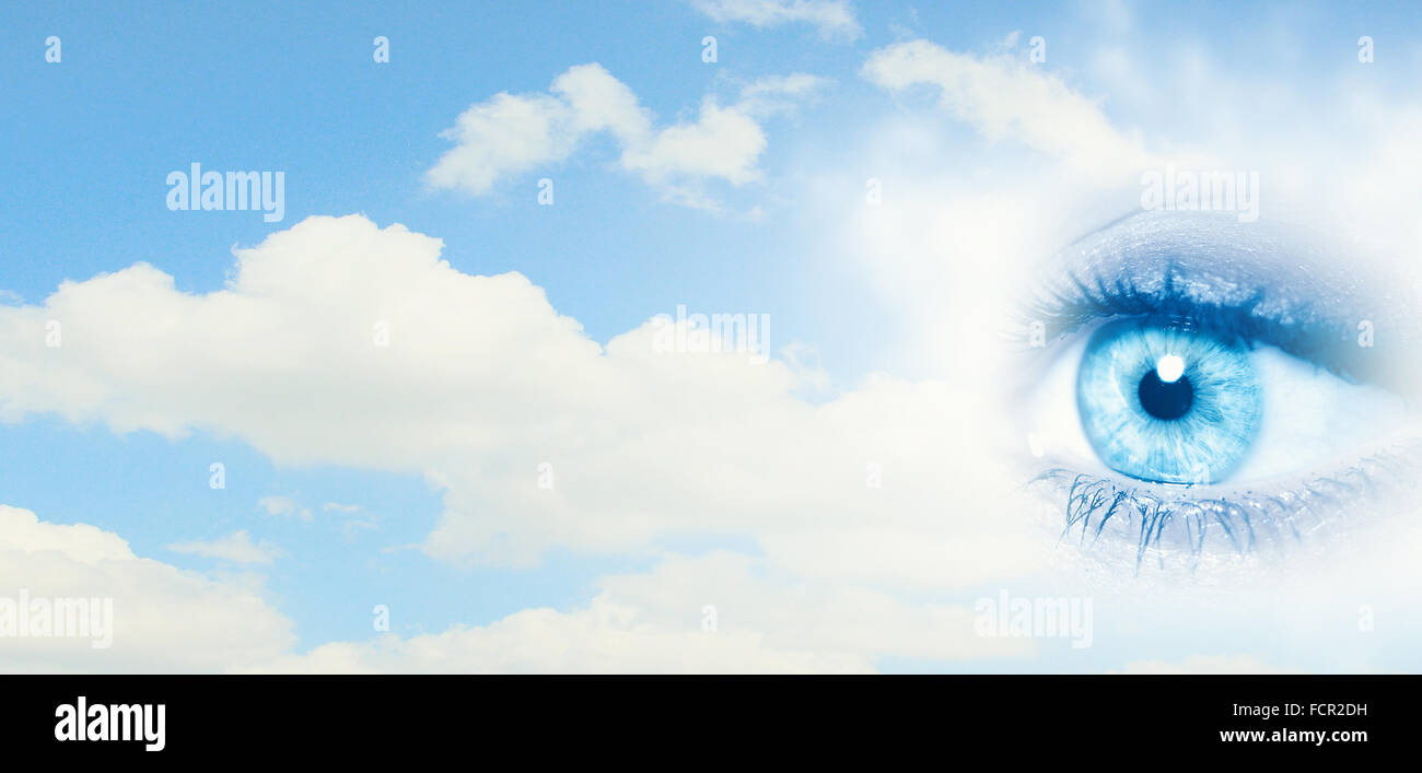 Female clear eye on blue sky background Stock Photo - Alamy