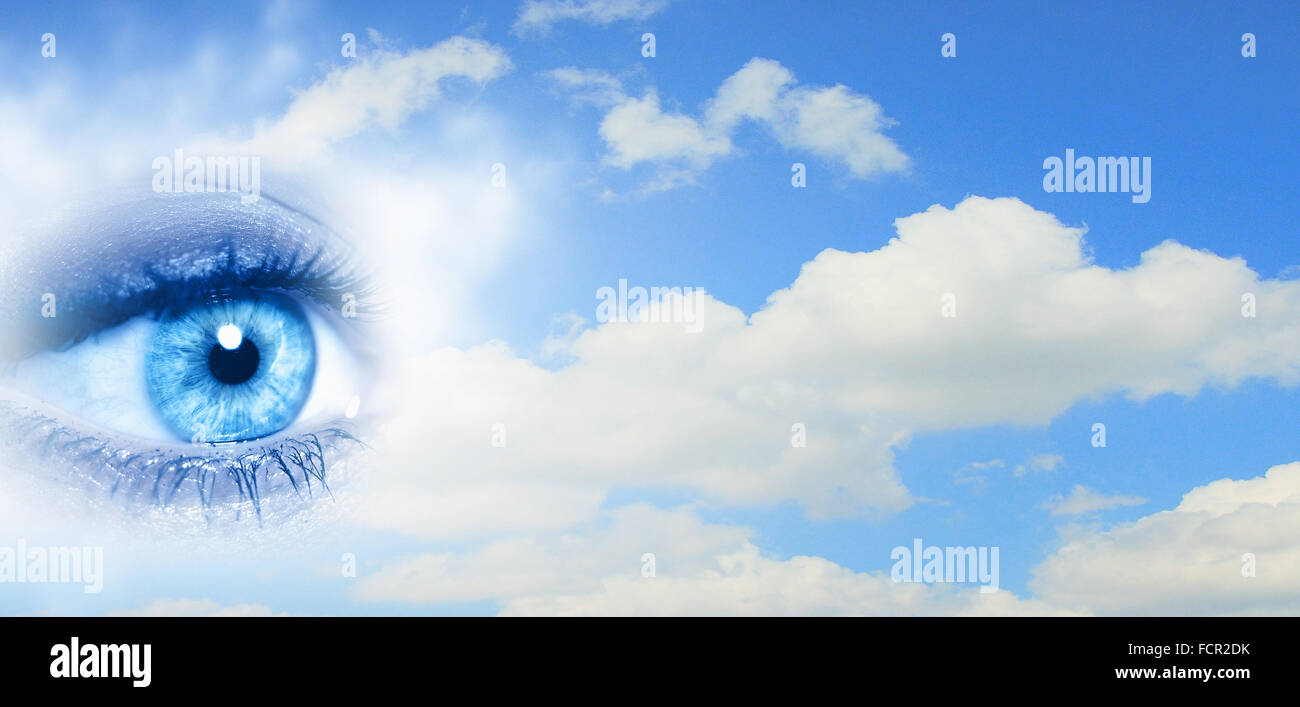 Female clear eye on blue sky background Stock Photo - Alamy