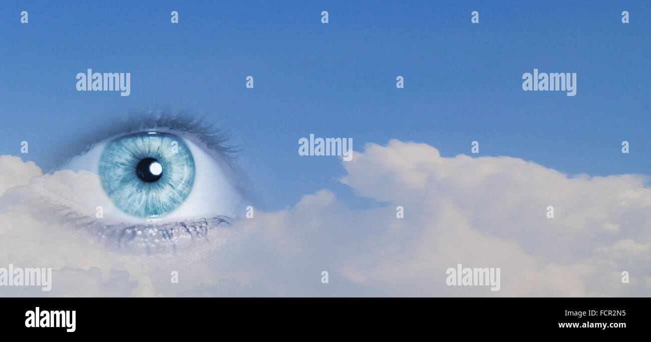 Female clear eye on blue sky background Stock Photo - Alamy