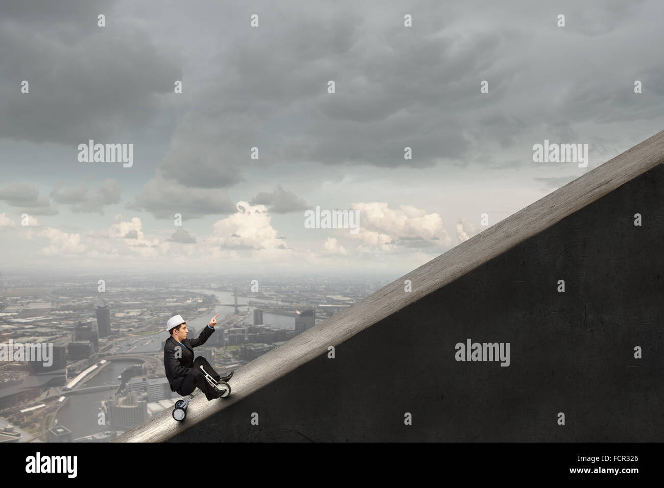 Young handsome businessman riding three wheeled bicycle Stock Photo - Alamy