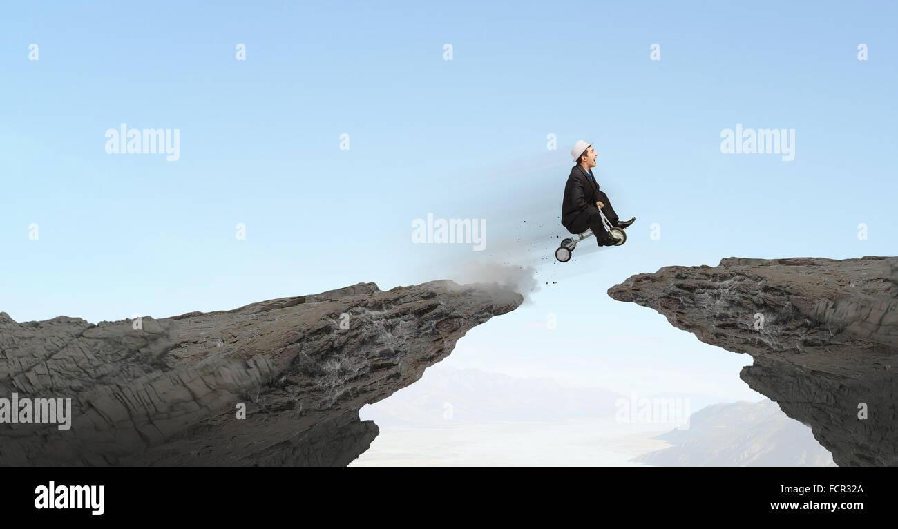 Young handsome businessman riding three wheeled bicycle Stock Photo - Alamy