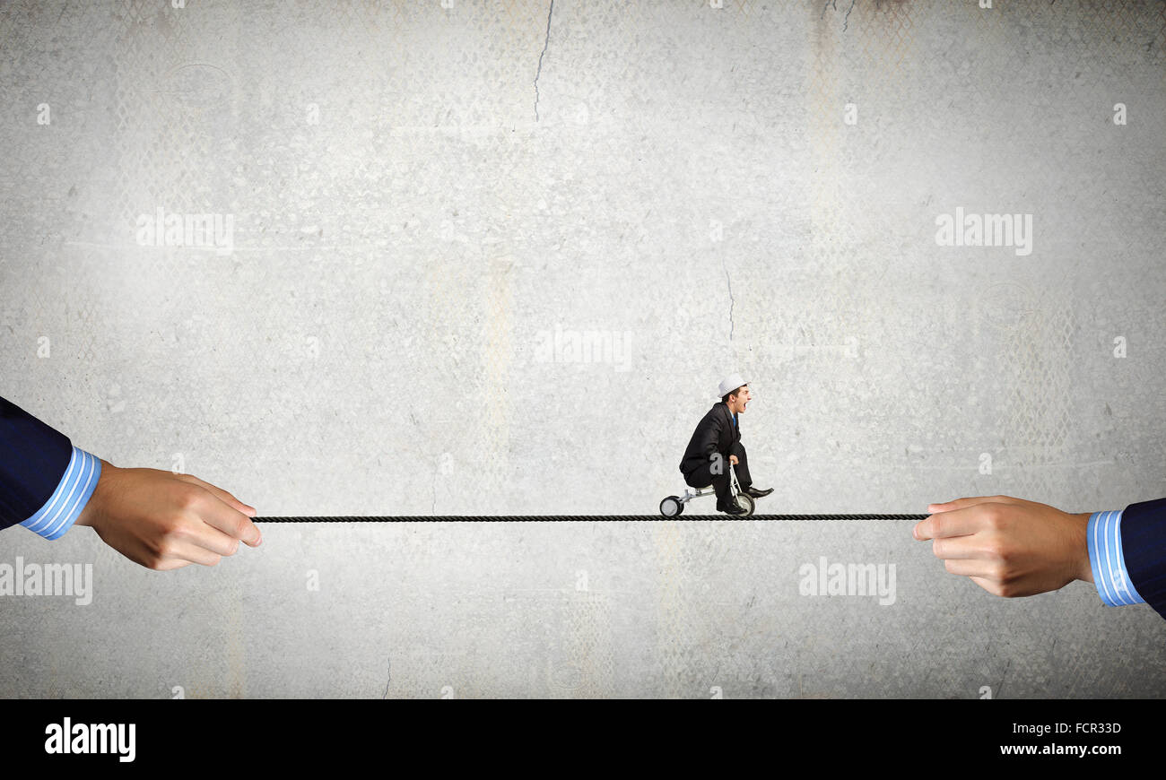 Young handsome businessman riding three wheeled bicycle Stock Photo - Alamy