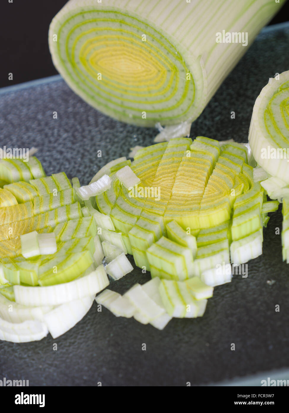 Slices of leek on a glass plate in a kitchen Stock Photo - Alamy