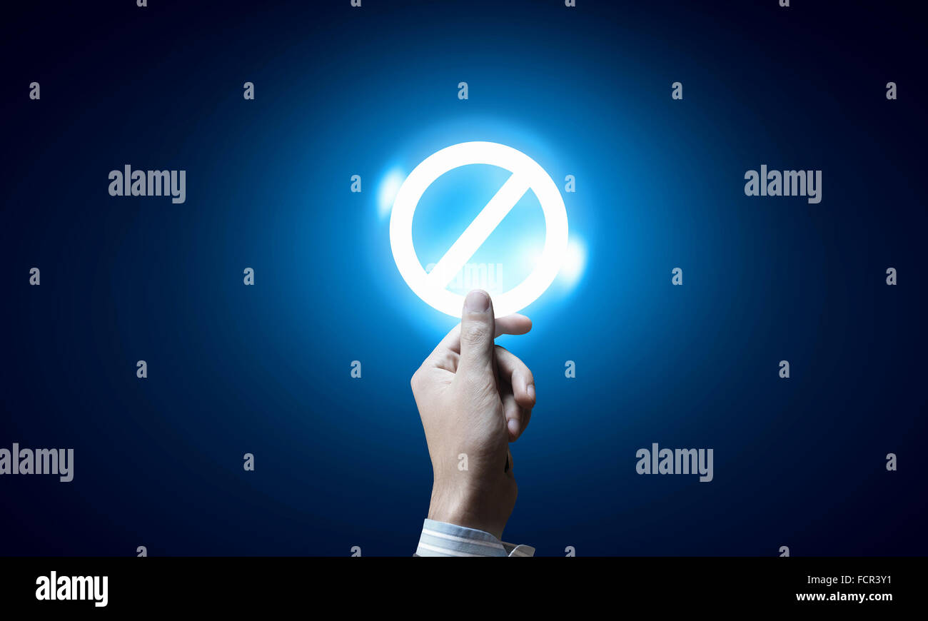 Close up of hand with stop media icon Stock Photo - Alamy