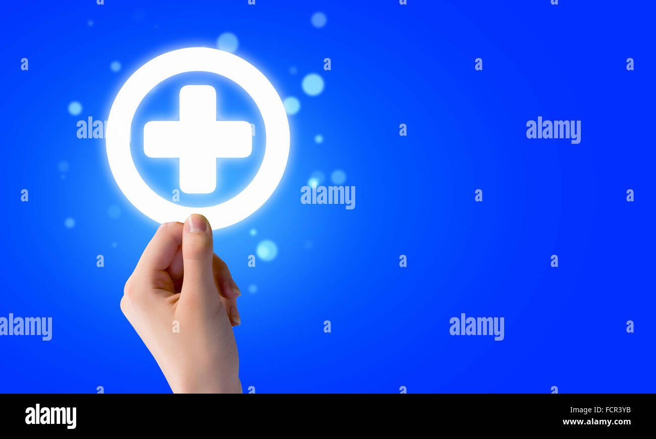 Hand pressing plus sign icon button on screen Stock Photo - Alamy