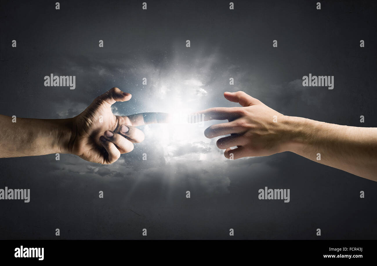 Close up of human hands reaching each other with fingers Stock Photo ...
