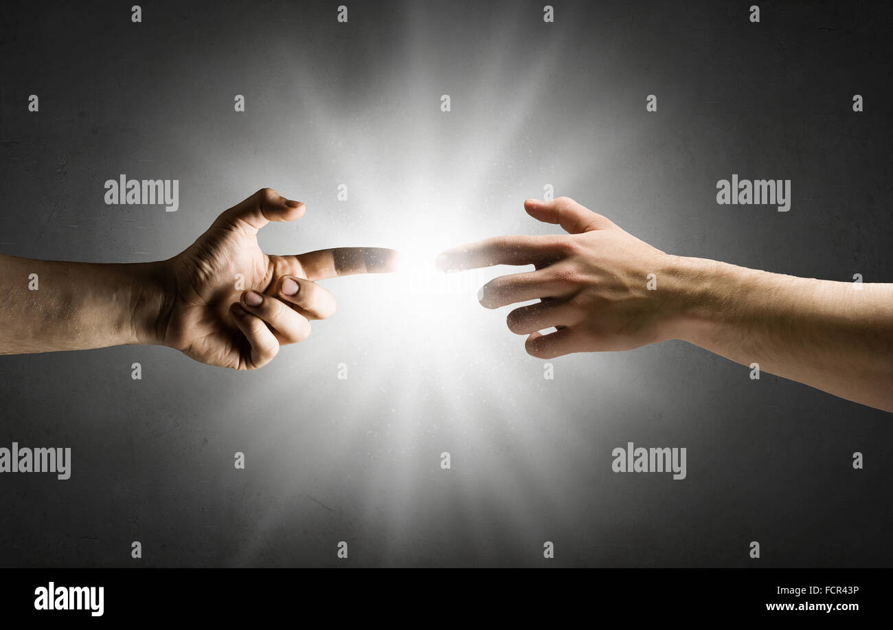 Close up of human hands reaching each other with fingers Stock Photo ...