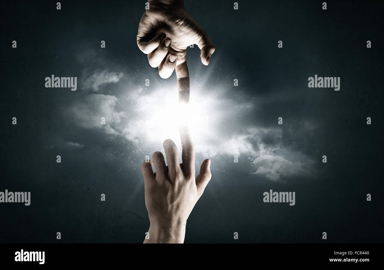 Close up of human hands reaching each other with fingers Stock Photo ...