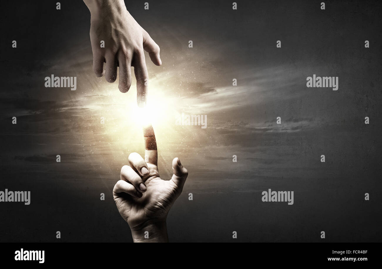 Close up of human hands reaching each other with fingers Stock Photo ...