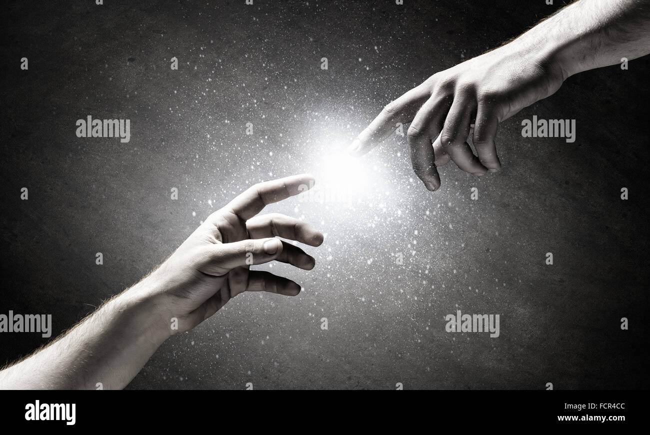 Close up of human hands reaching each other with fingers Stock Photo ...