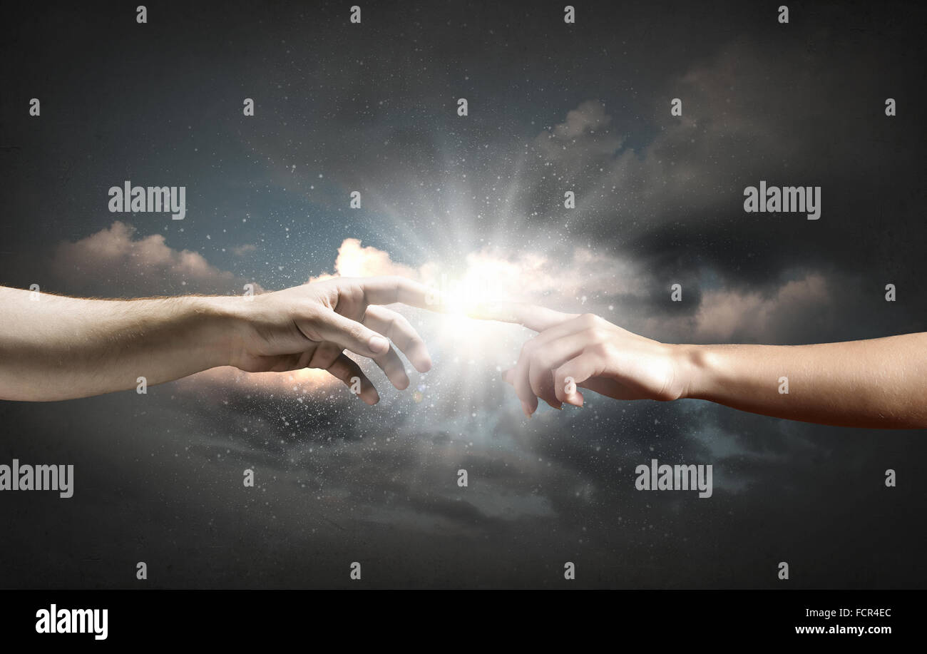 Close up of human hands reaching each other with fingers Stock Photo ...