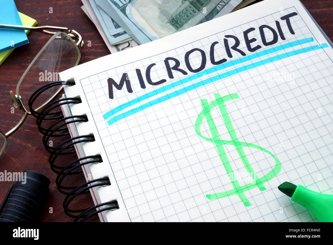Microcredit written on a notebook. Business concept Stock Photo - Alamy