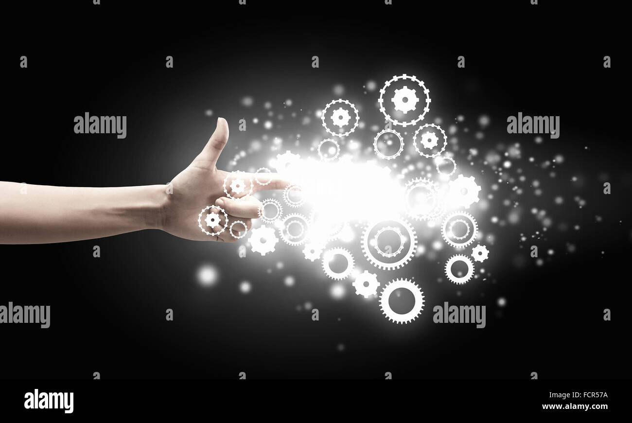 Close up human hand pointing at gears mechanism Stock Photo - Alamy