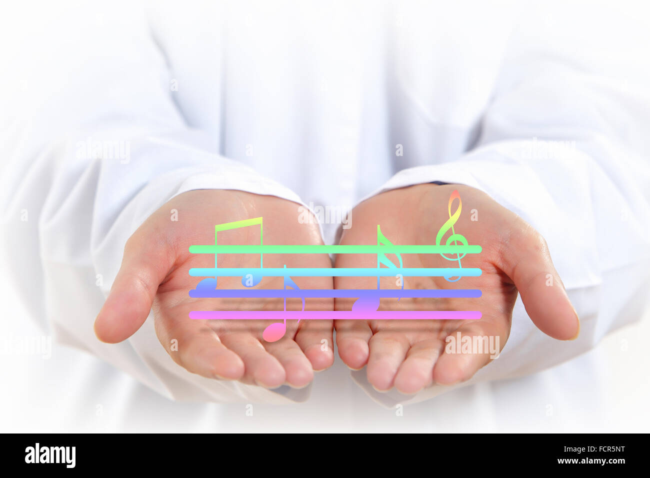 Close up of human hands with music notes figures Stock Photo - Alamy