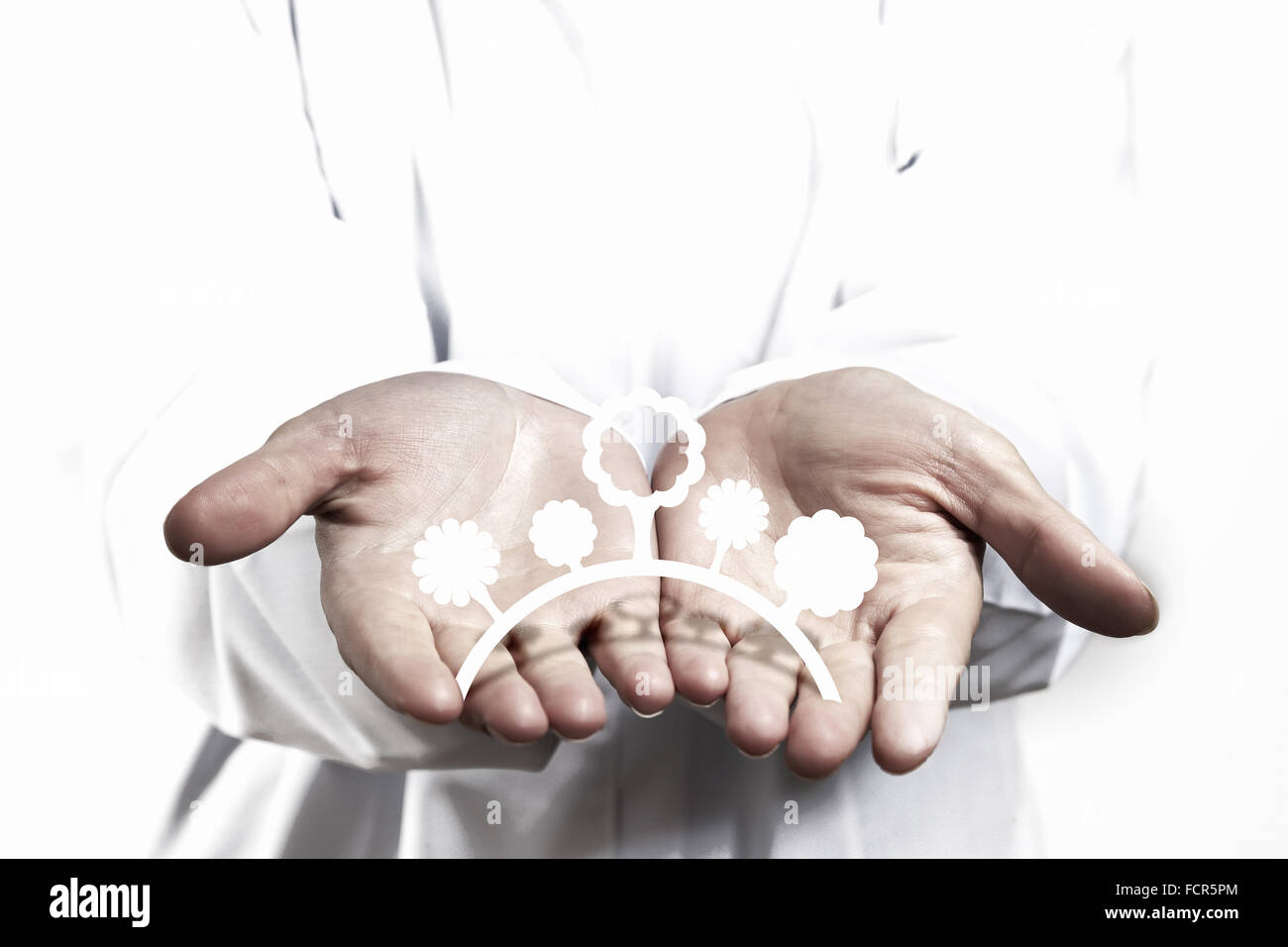 Close up of human hands with figures of nature Stock Photo - Alamy