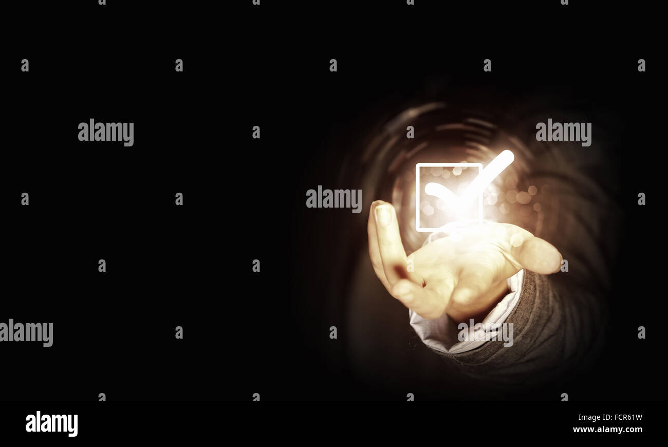 Close up of businessman's hand holding check mark icon in palm Stock ...