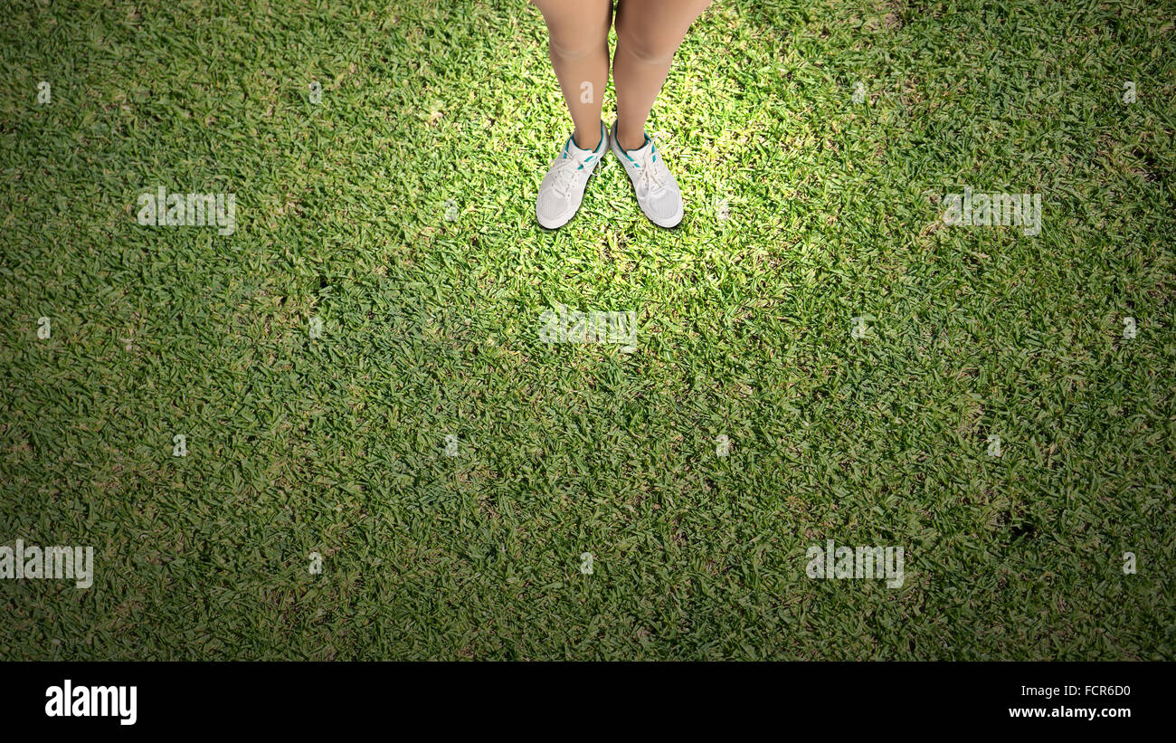 Top view of female legs in white sport shoes Stock Photo - Alamy