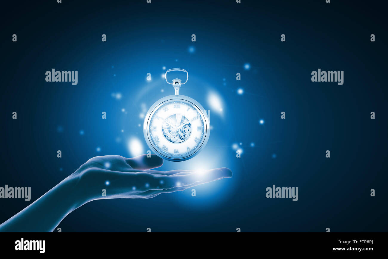 Close up of businessman hand holding pocket watch in hand Stock Photo ...