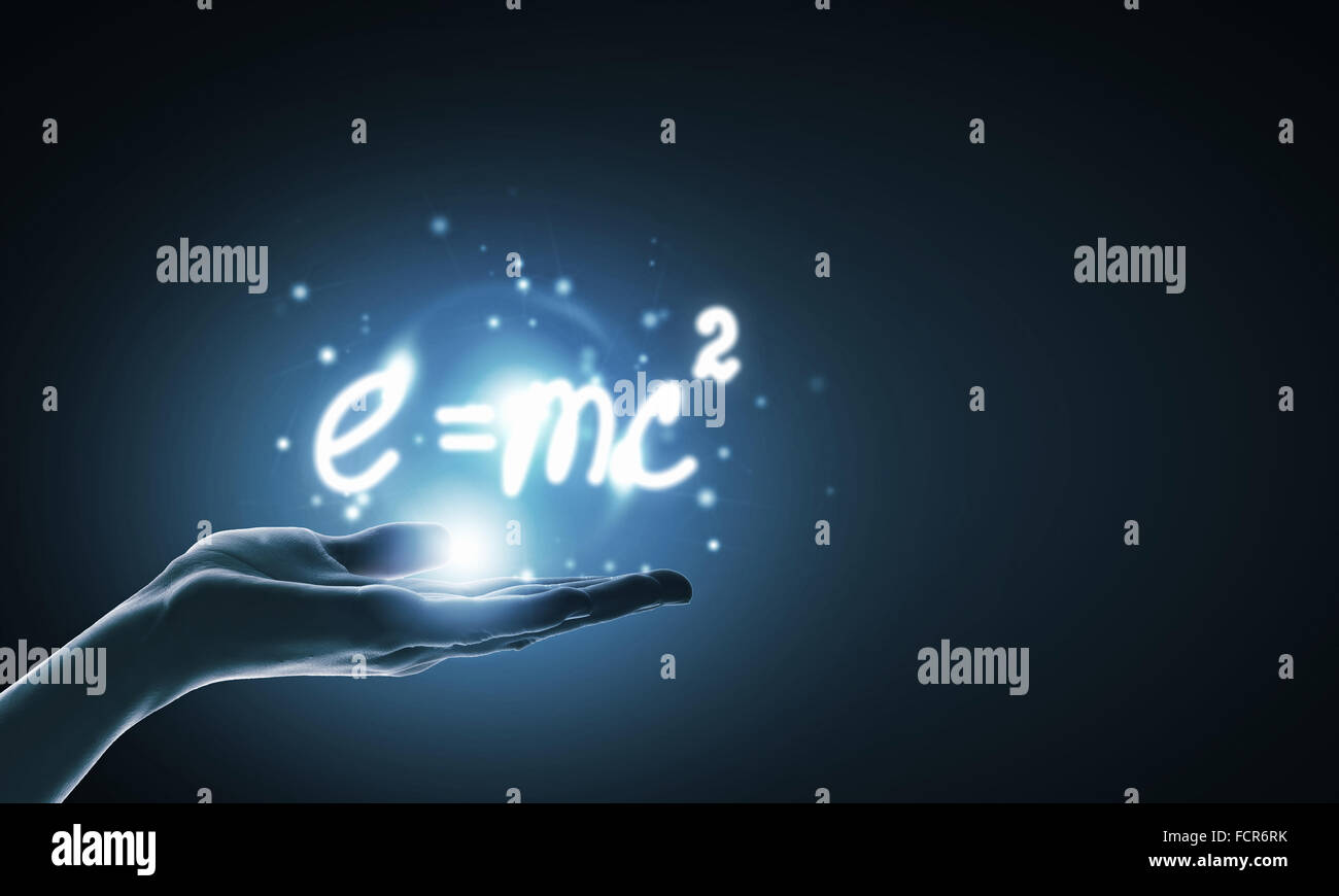 Close up of hand holding science formula icon Stock Photo - Alamy