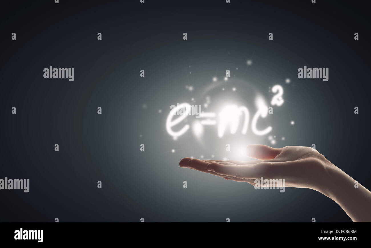 Close up of hand holding science formula icon Stock Photo - Alamy