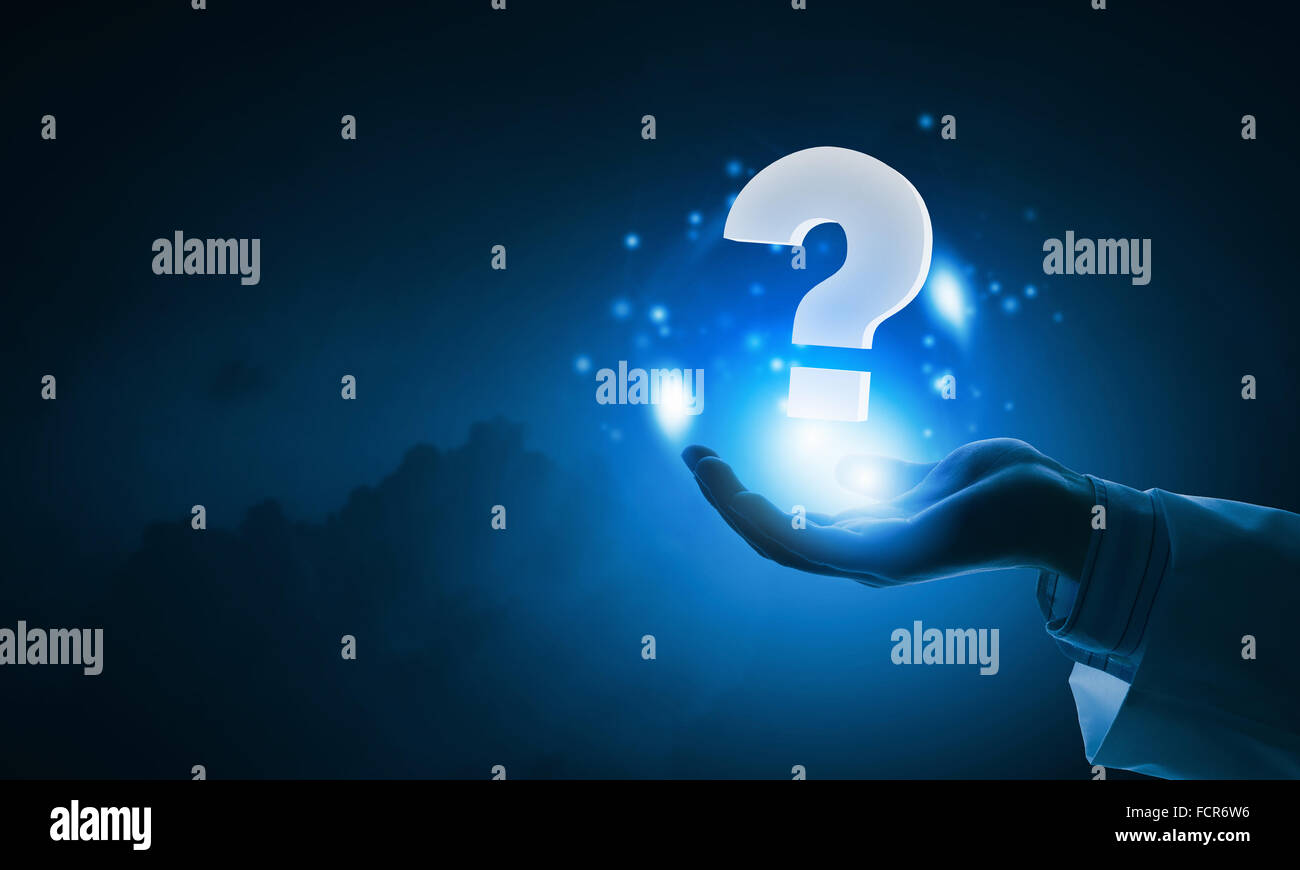 Close up of male hand holding question mark icon Stock Photo - Alamy